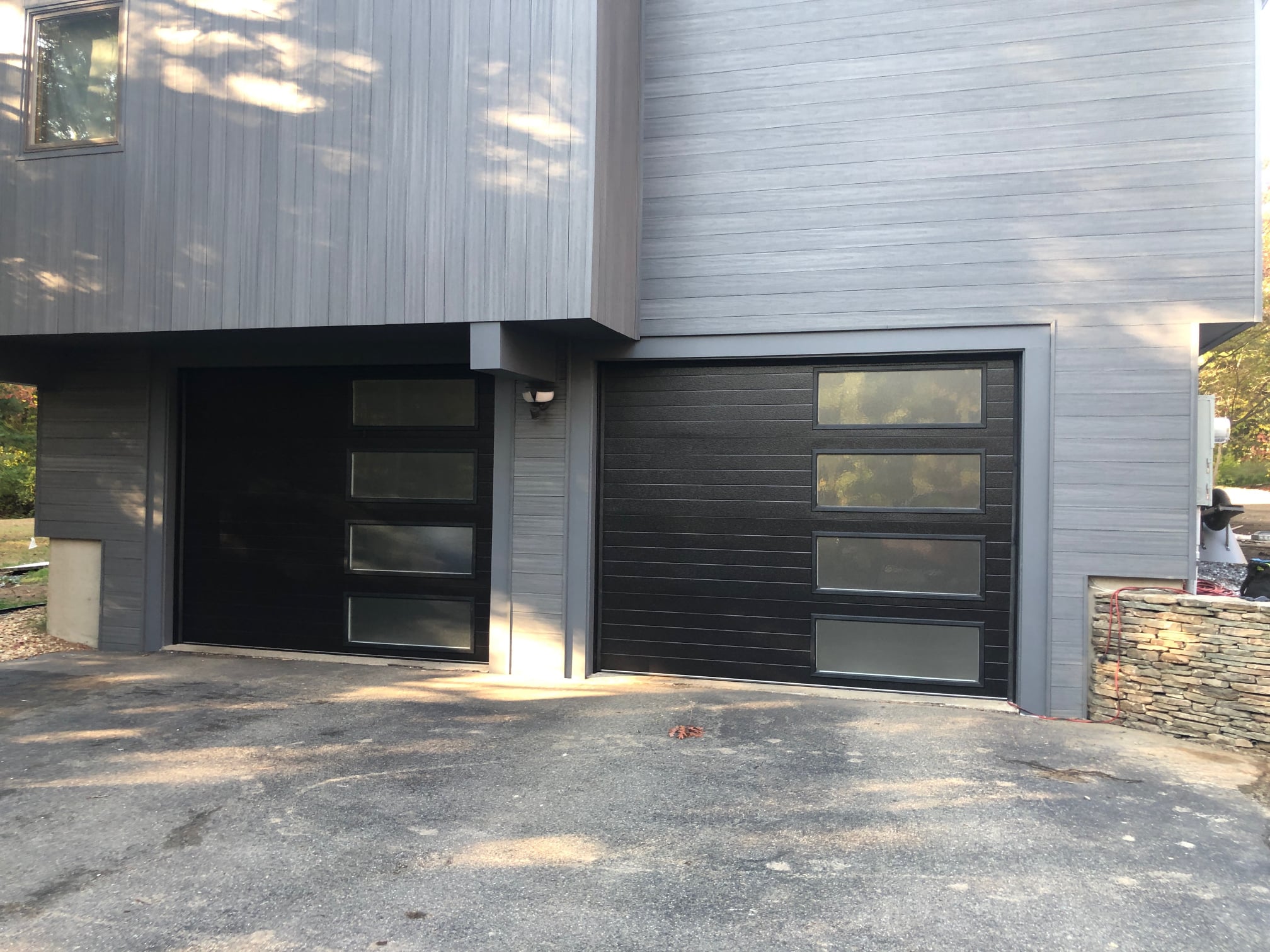 Modern Steel™ Garage Door With Contemporary Windows Installation In ...